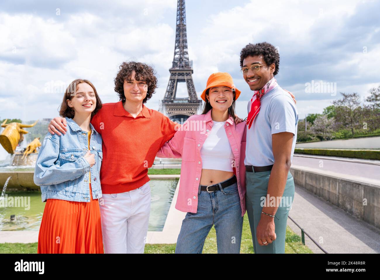 Group of young happy friends visiting Paris and Eiffel Tower, Trocadero ...