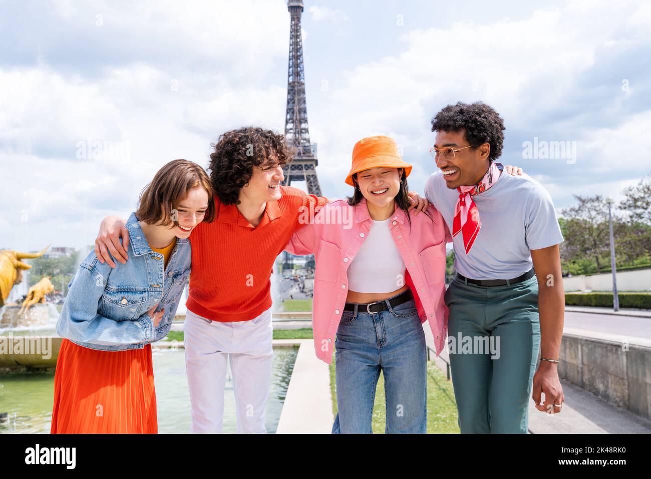 Group of young happy friends visiting Paris and Eiffel Tower, Trocadero ...