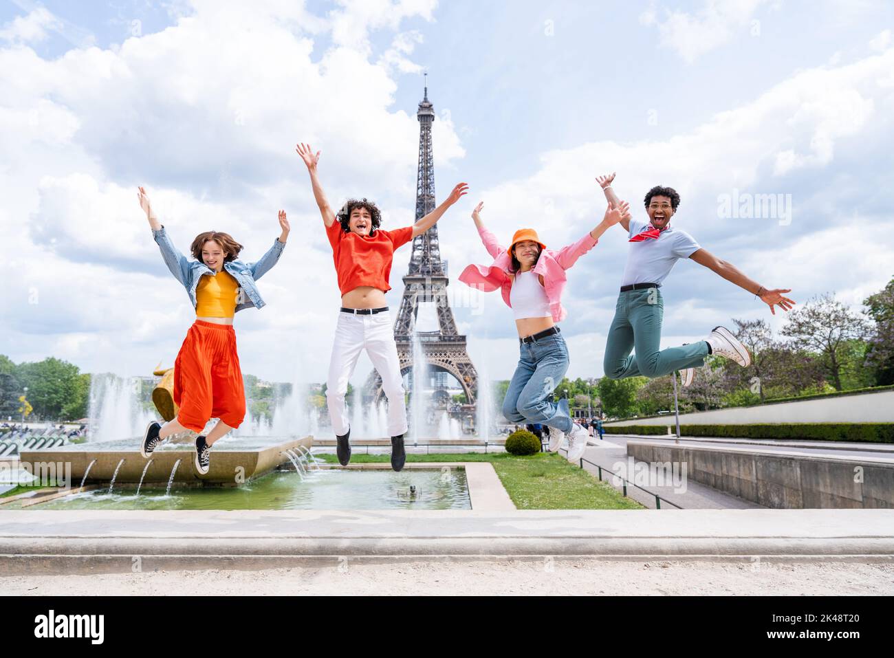 Group of young happy friends visiting Paris and Eiffel Tower, Trocadero ...