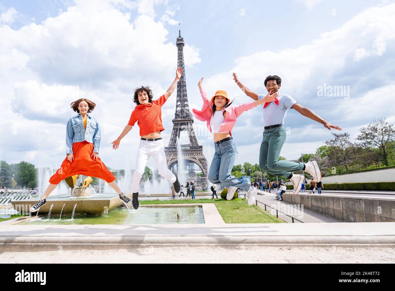 Group of young happy friends visiting Paris and Eiffel Tower, Trocadero ...