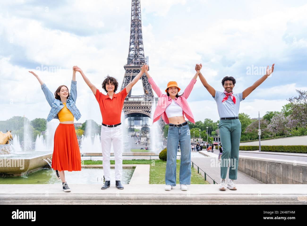 Group of young happy friends visiting Paris and Eiffel Tower, Trocadero ...