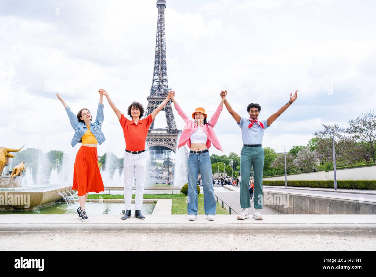 Group of young happy friends visiting Paris and Eiffel Tower, Trocadero ...