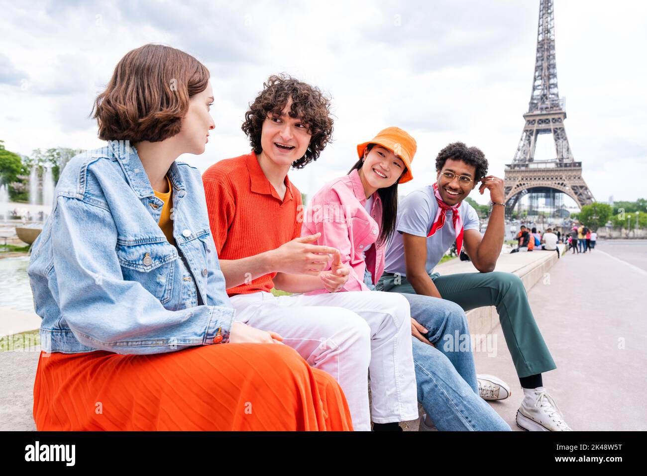 Group of young happy friends visiting Paris and Eiffel Tower, Trocadero ...