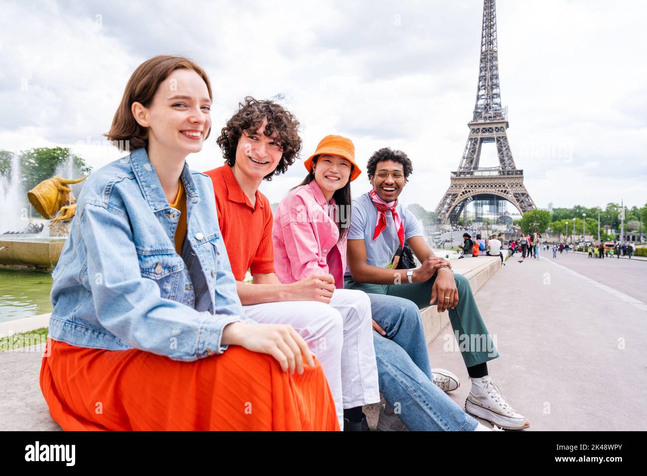 Group of young happy friends visiting Paris and Eiffel Tower, Trocadero ...