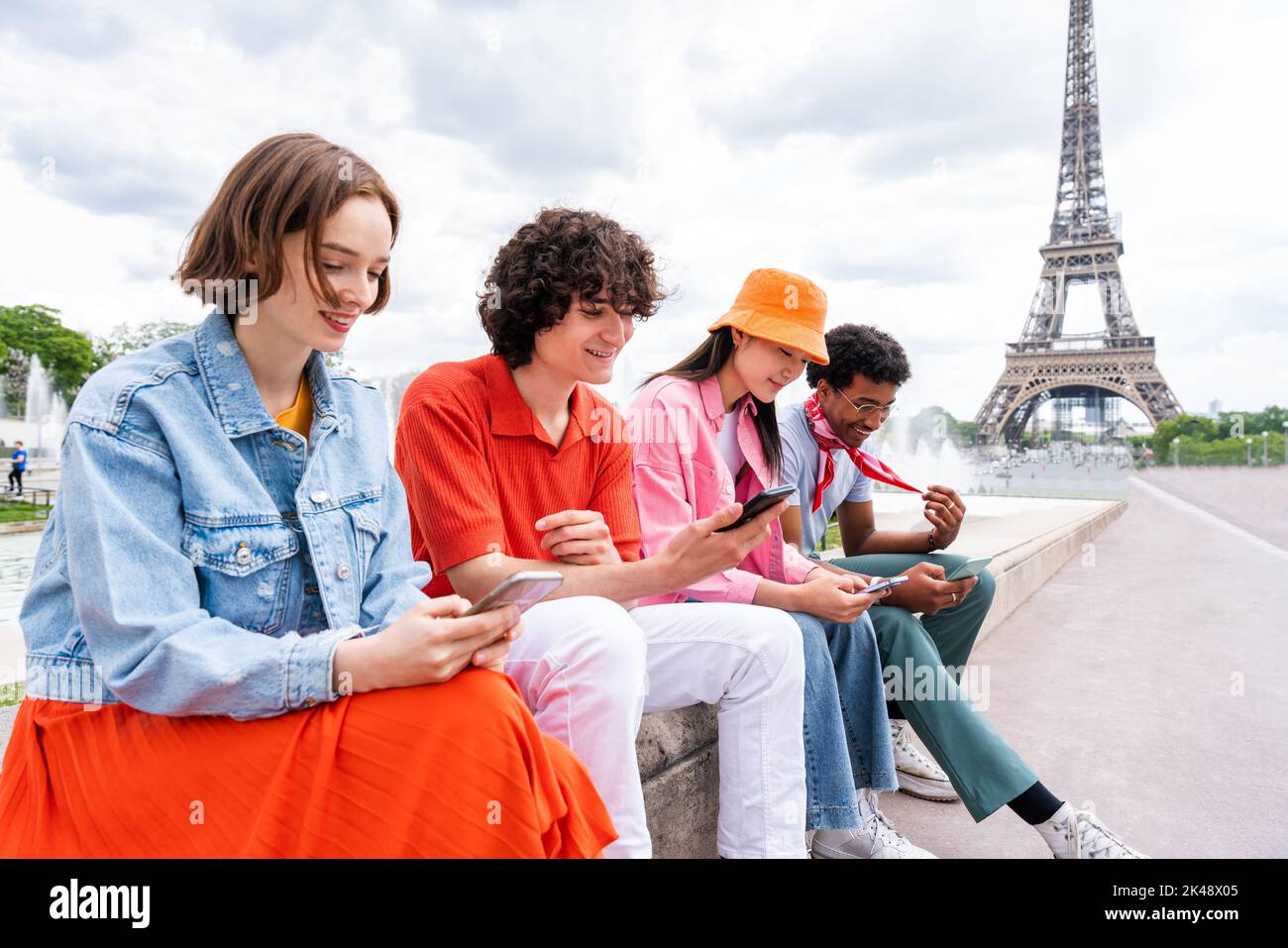 Group of young happy friends visiting Paris and Eiffel Tower, Trocadero ...