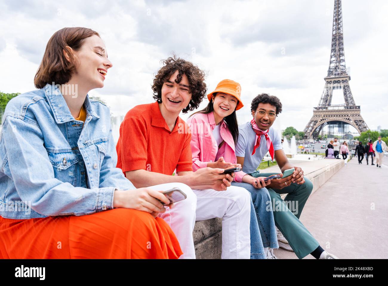 Group of young happy friends visiting Paris and Eiffel Tower, Trocadero ...