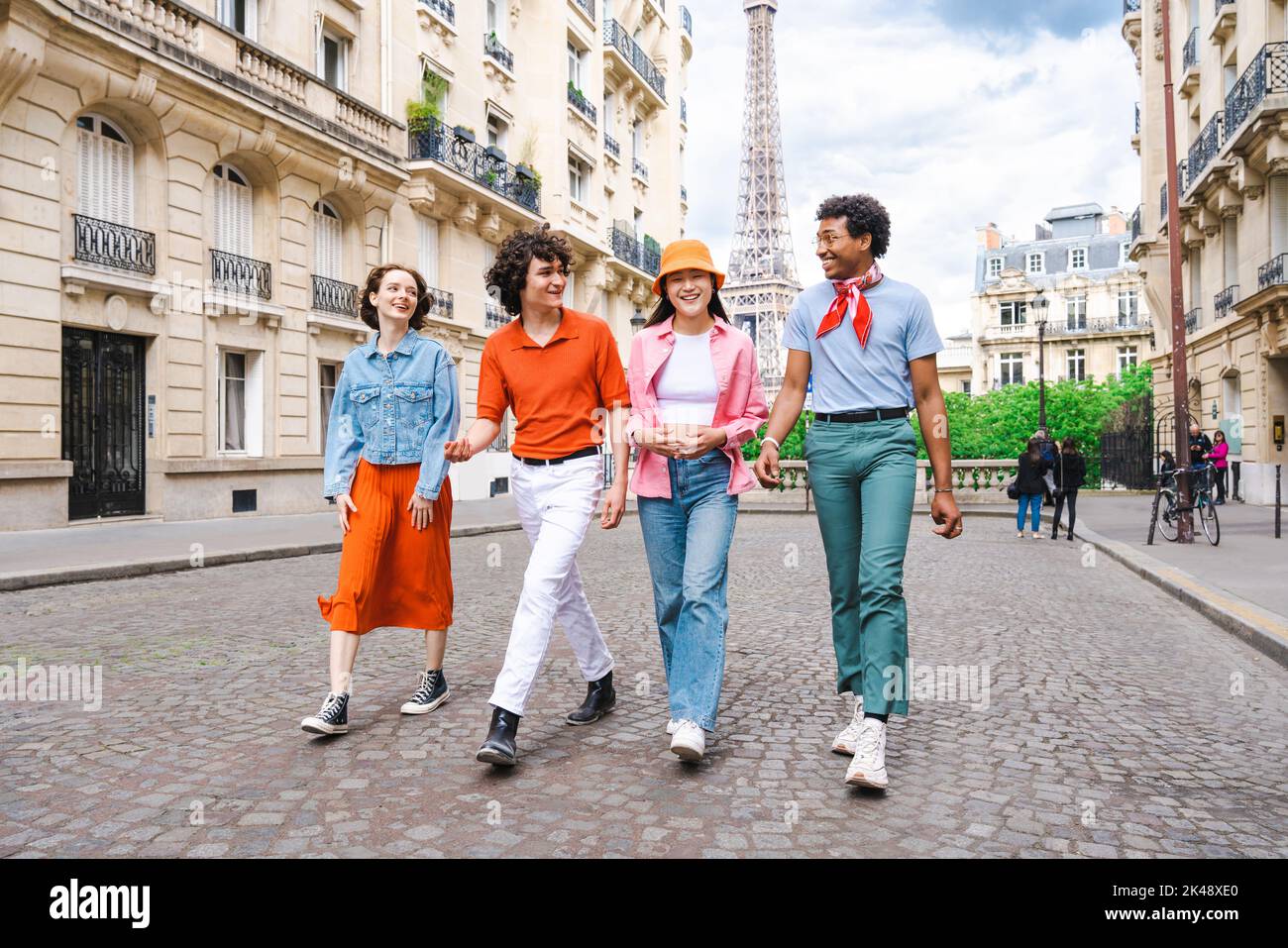 Group of young happy friends visiting Paris and Eiffel Tower, Trocadero ...