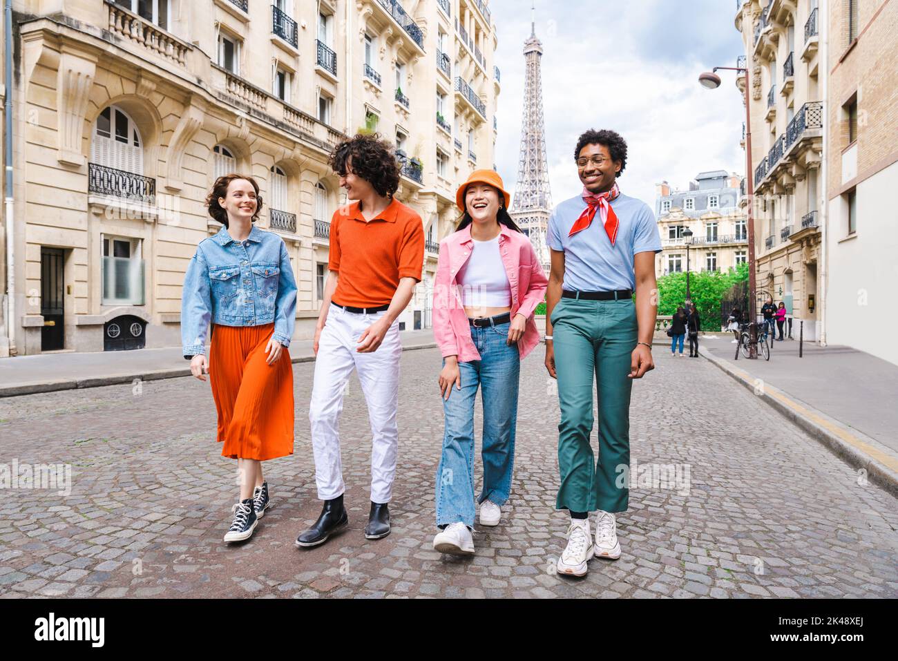 Group of young happy friends visiting Paris and Eiffel Tower, Trocadero ...