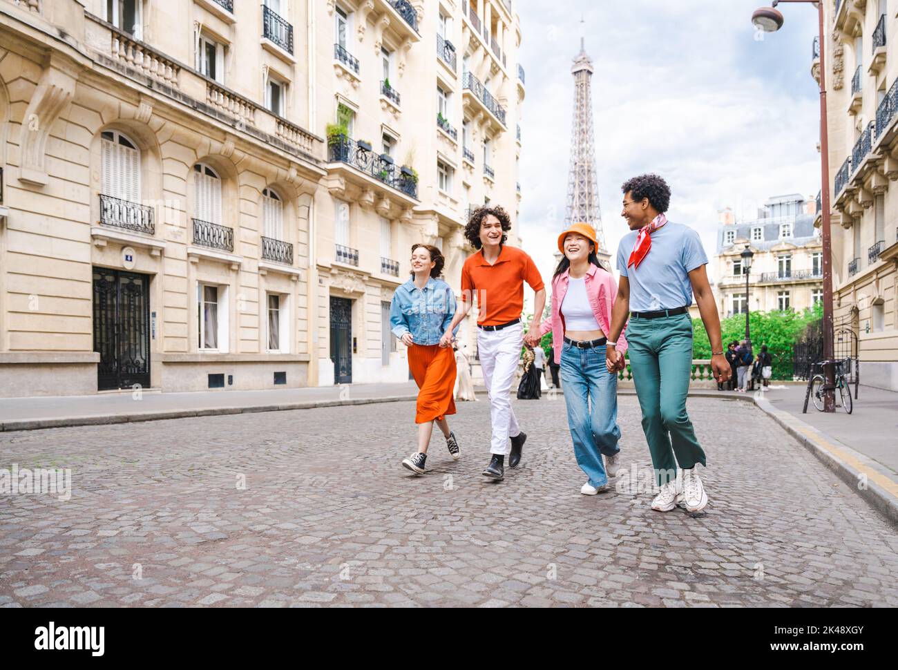 Group of young happy friends visiting Paris and Eiffel Tower, Trocadero ...