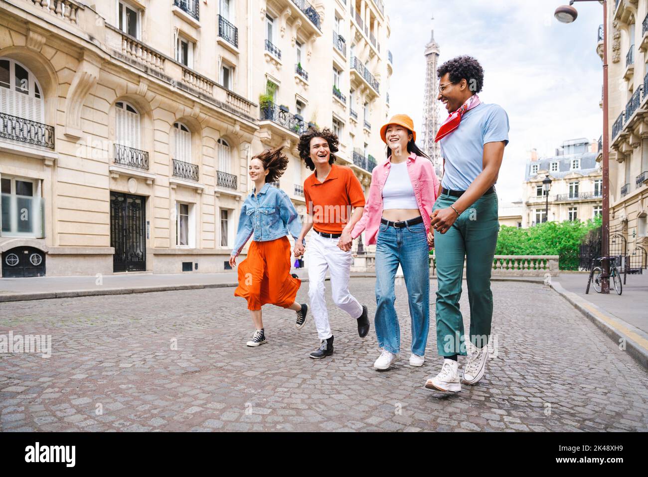 Group of young happy friends visiting Paris and Eiffel Tower, Trocadero ...