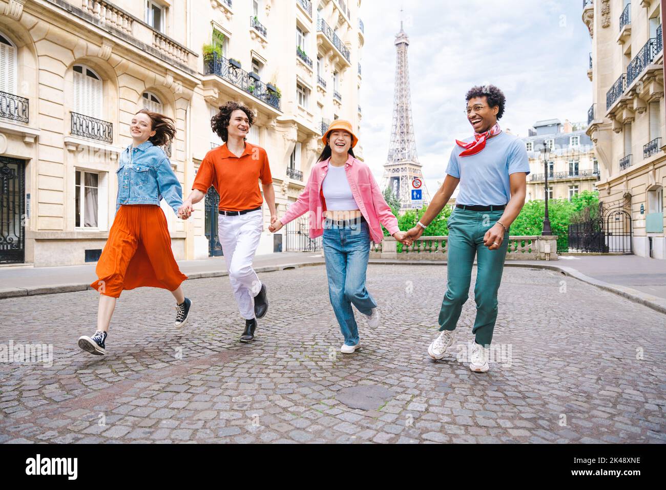 Group of young happy friends visiting Paris and Eiffel Tower, Trocadero ...