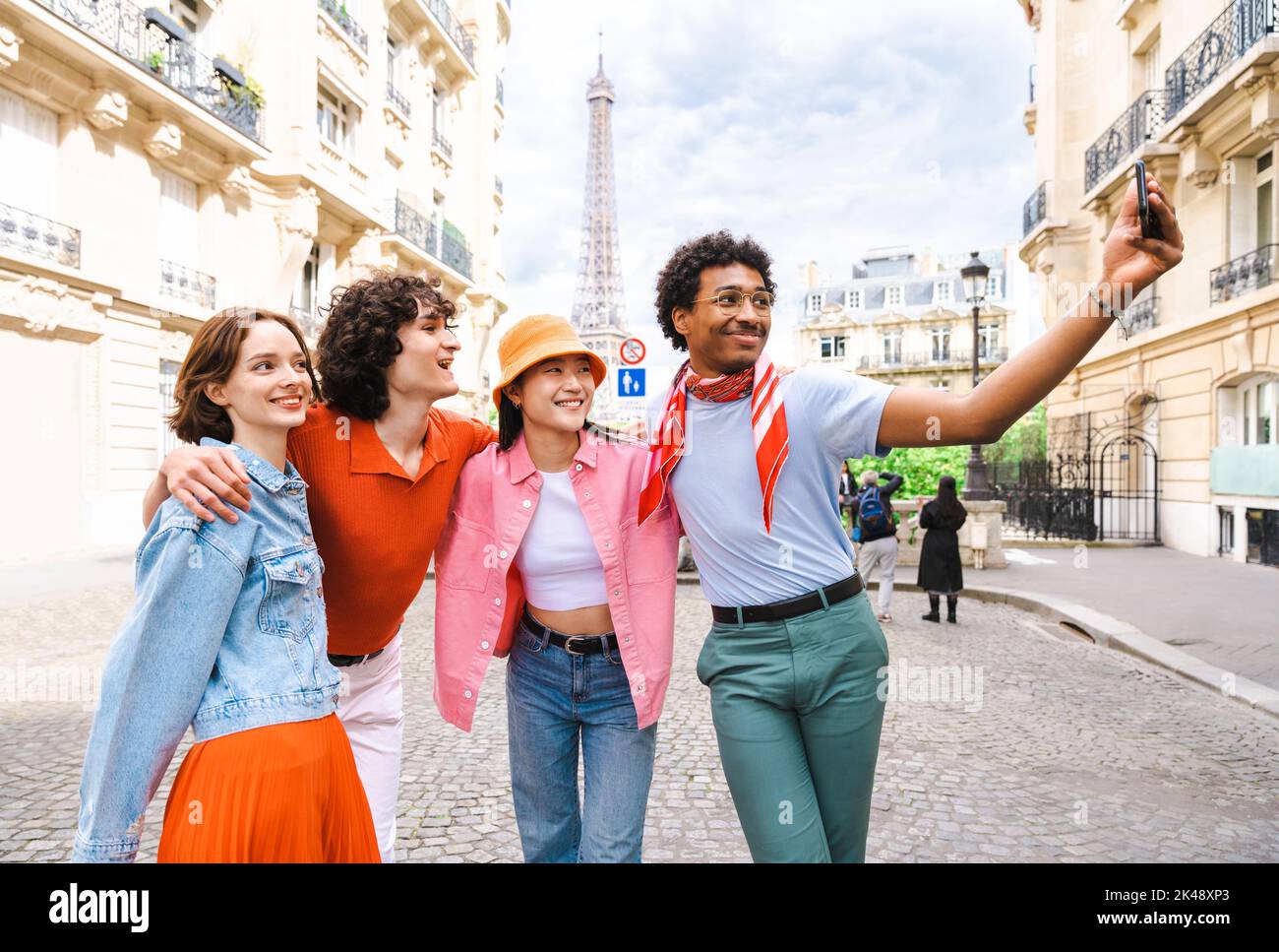 Group of young happy friends visiting Paris and Eiffel Tower, Trocadero ...