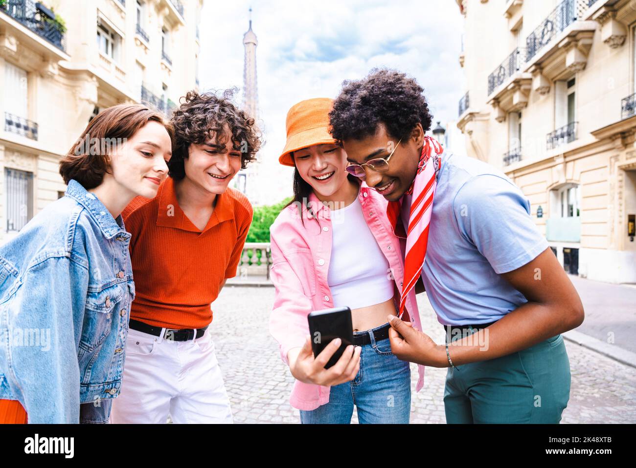 Group of young happy friends visiting Paris and Eiffel Tower, Trocadero ...