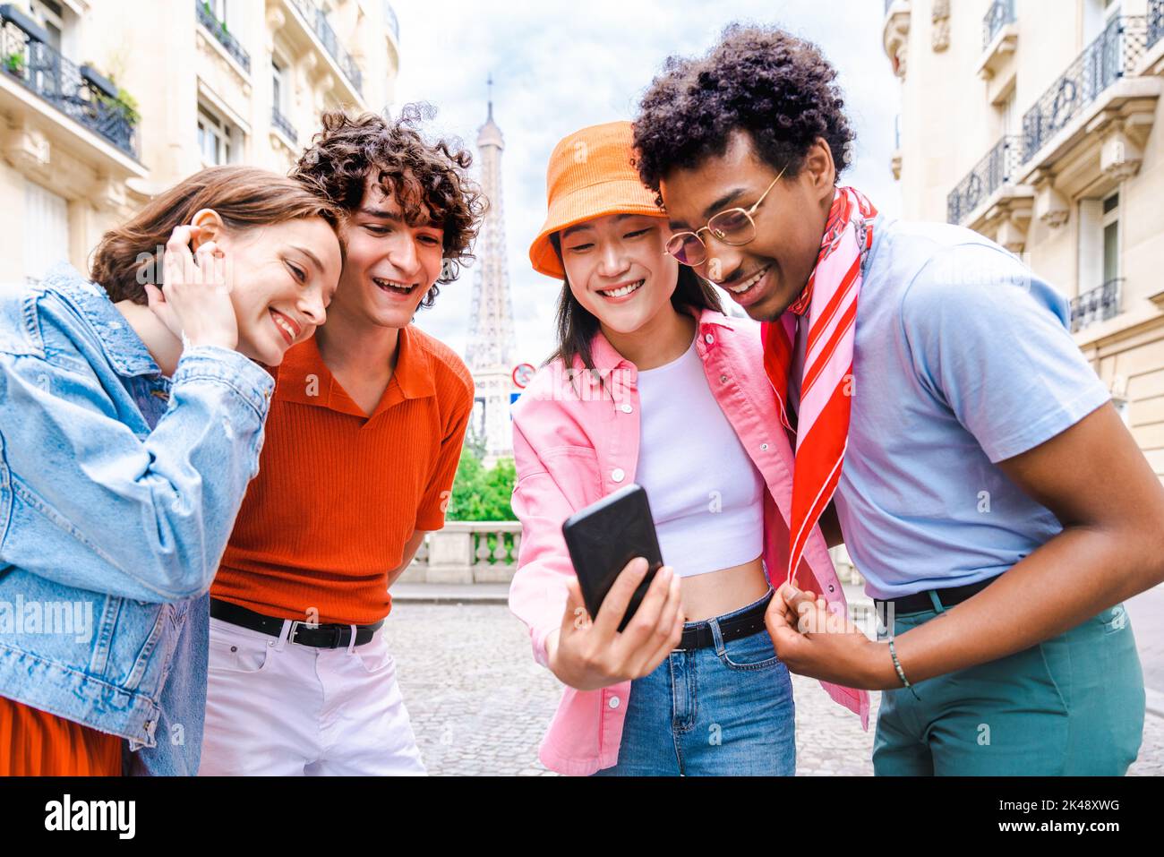 Group of young happy friends visiting Paris and Eiffel Tower, Trocadero ...
