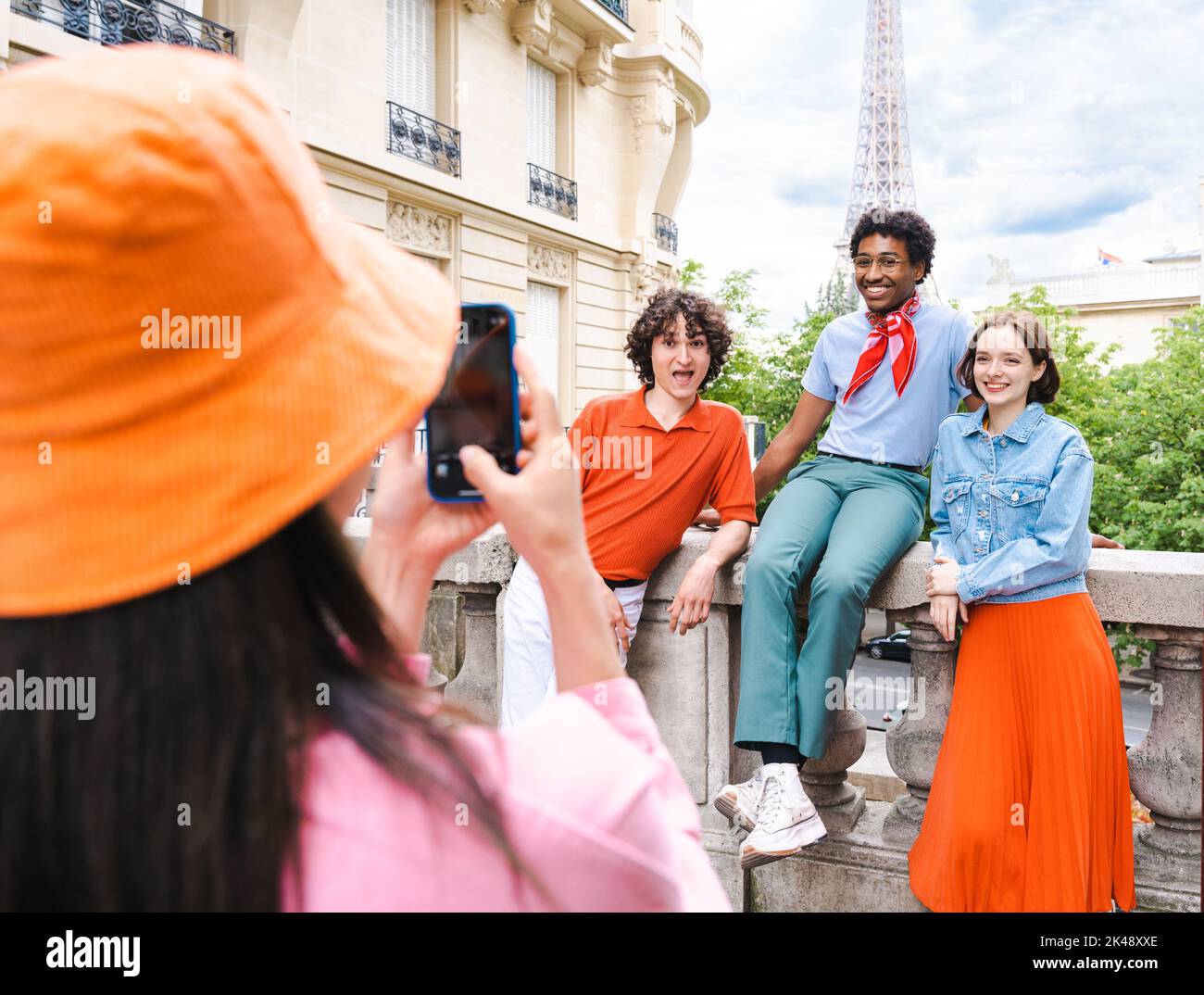 Group of young happy friends visiting Paris and Eiffel Tower, Trocadero ...