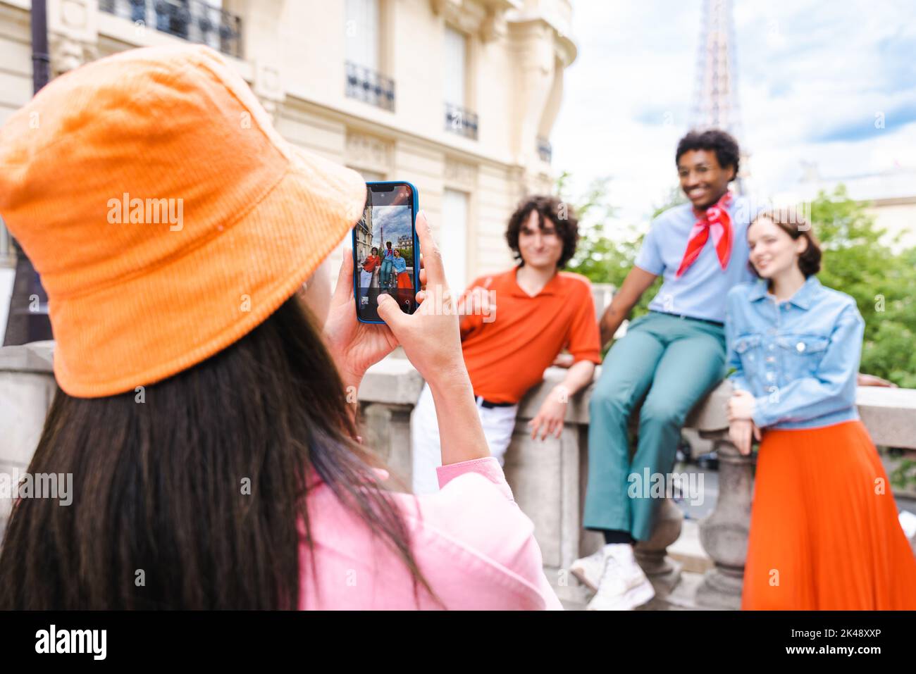Group of young happy friends visiting Paris and Eiffel Tower, Trocadero ...