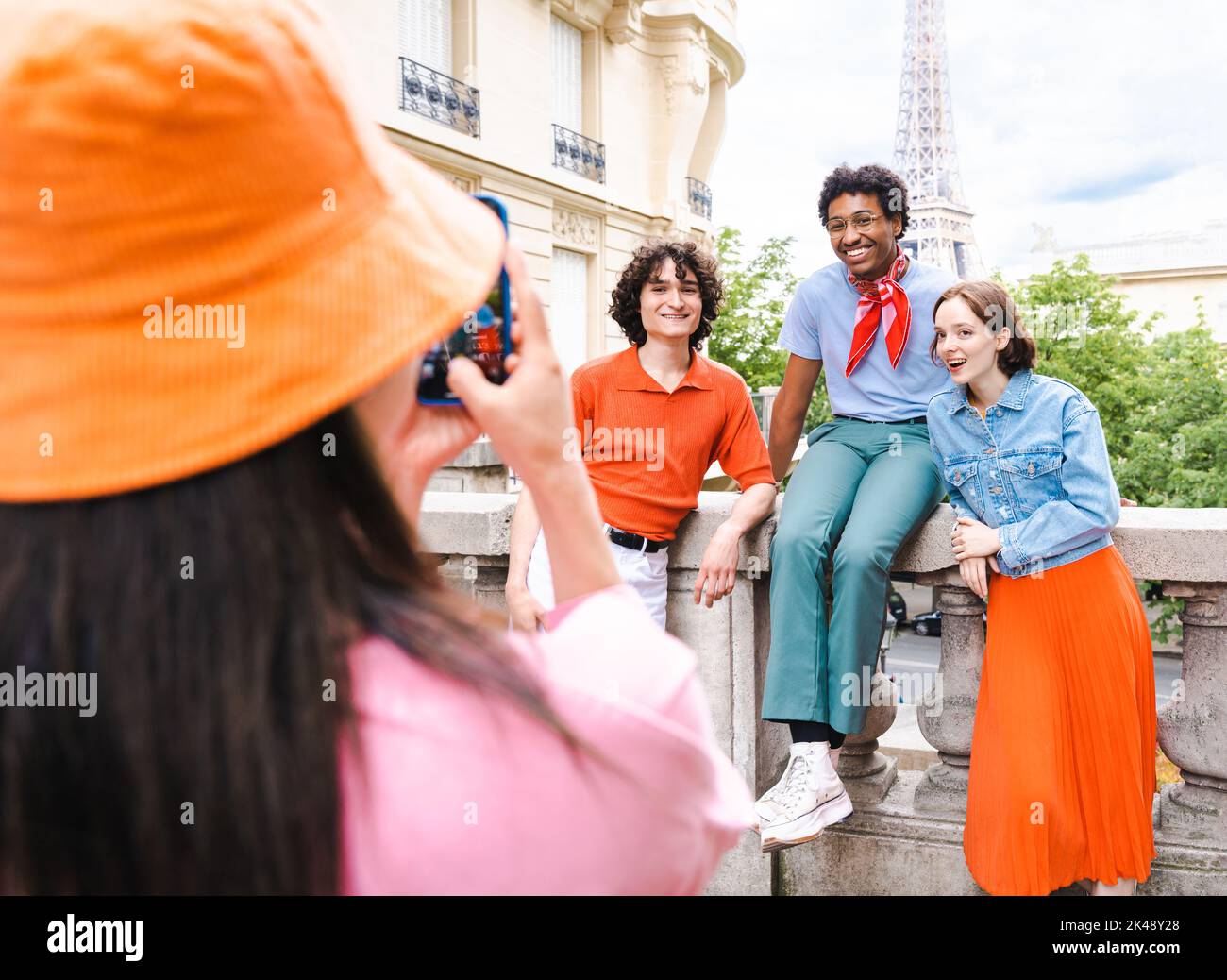 Group of young happy friends visiting Paris and Eiffel Tower, Trocadero ...