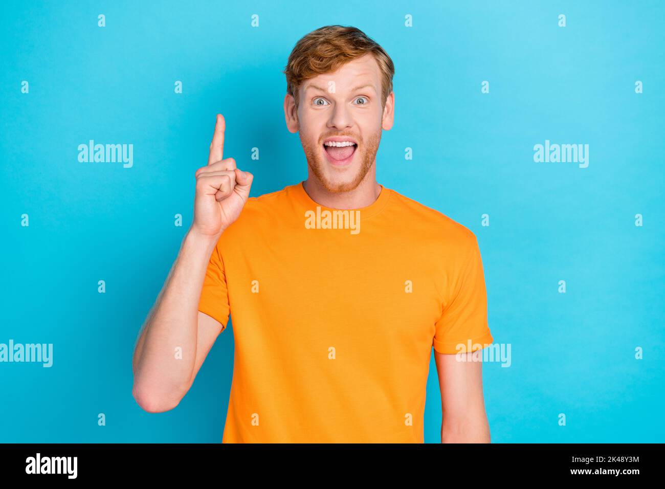 Photo of satisfied funky boy man raise hand arm consider find plan ...