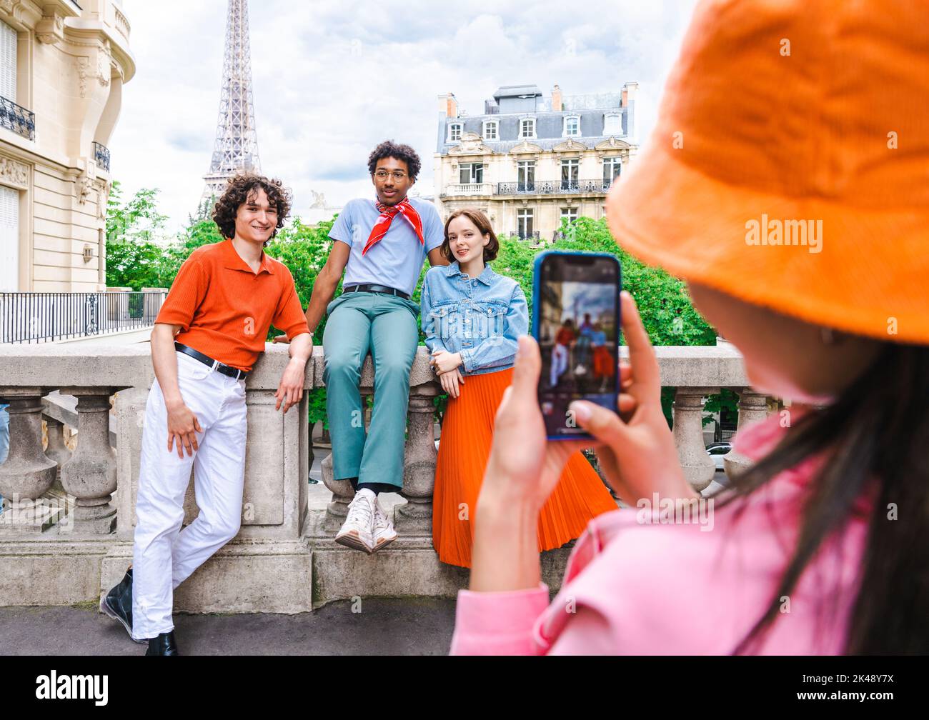 Group of young happy friends visiting Paris and Eiffel Tower, Trocadero ...