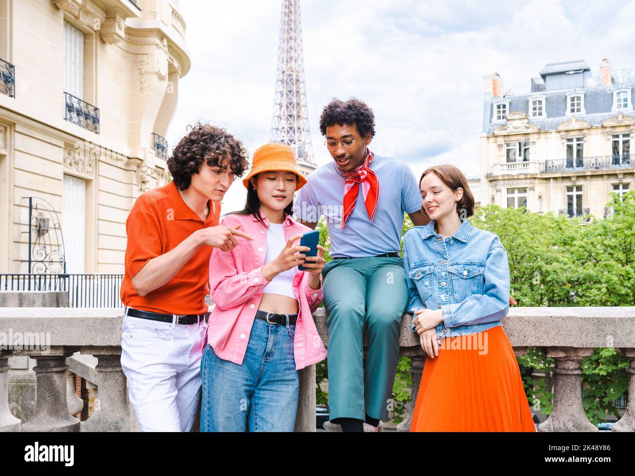 Group of young happy friends visiting Paris and Eiffel Tower, Trocadero ...