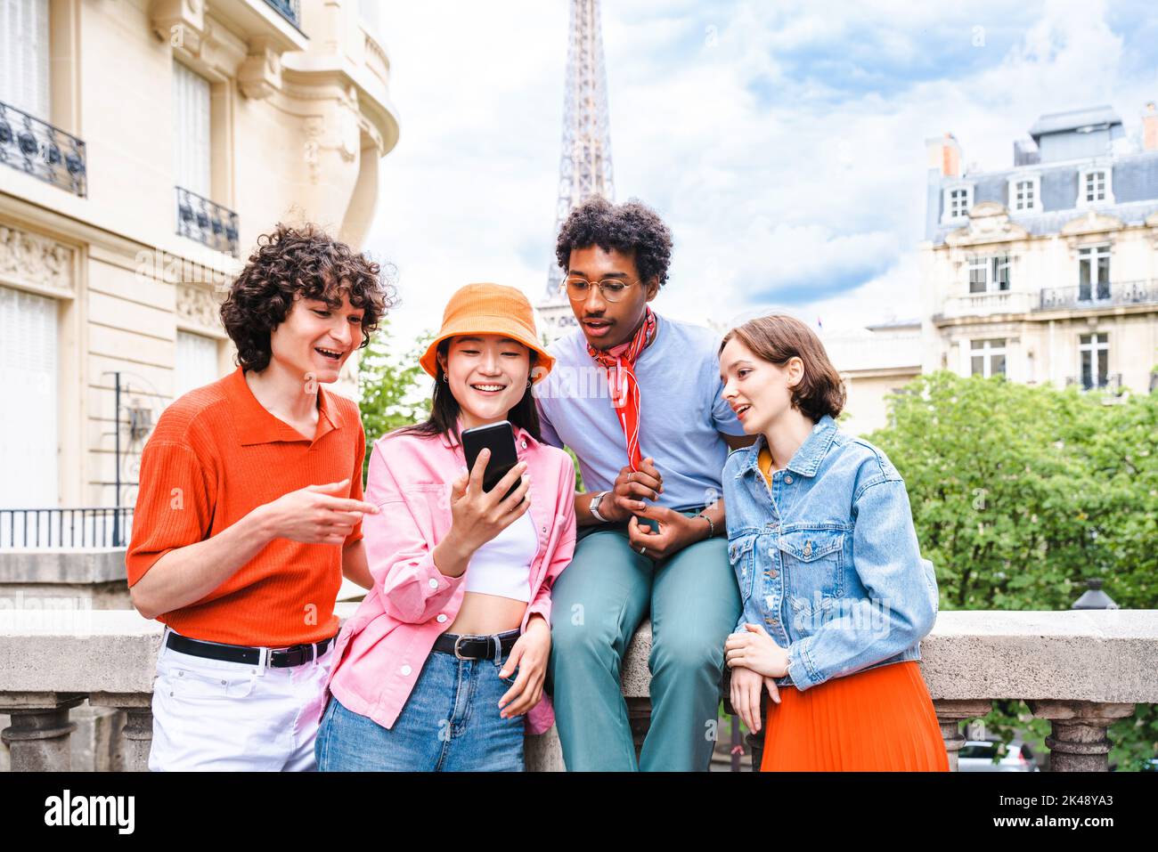 Group of young happy friends visiting Paris and Eiffel Tower, Trocadero ...