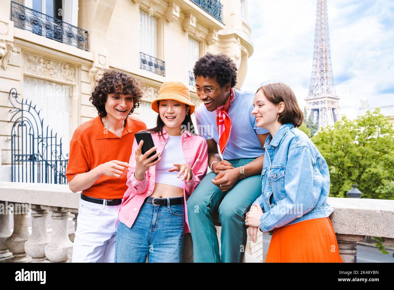 Group of young happy friends visiting Paris and Eiffel Tower, Trocadero ...