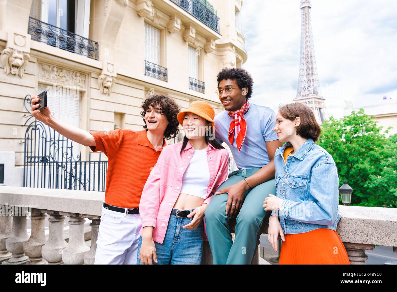 Group of young happy friends visiting Paris and Eiffel Tower, Trocadero ...