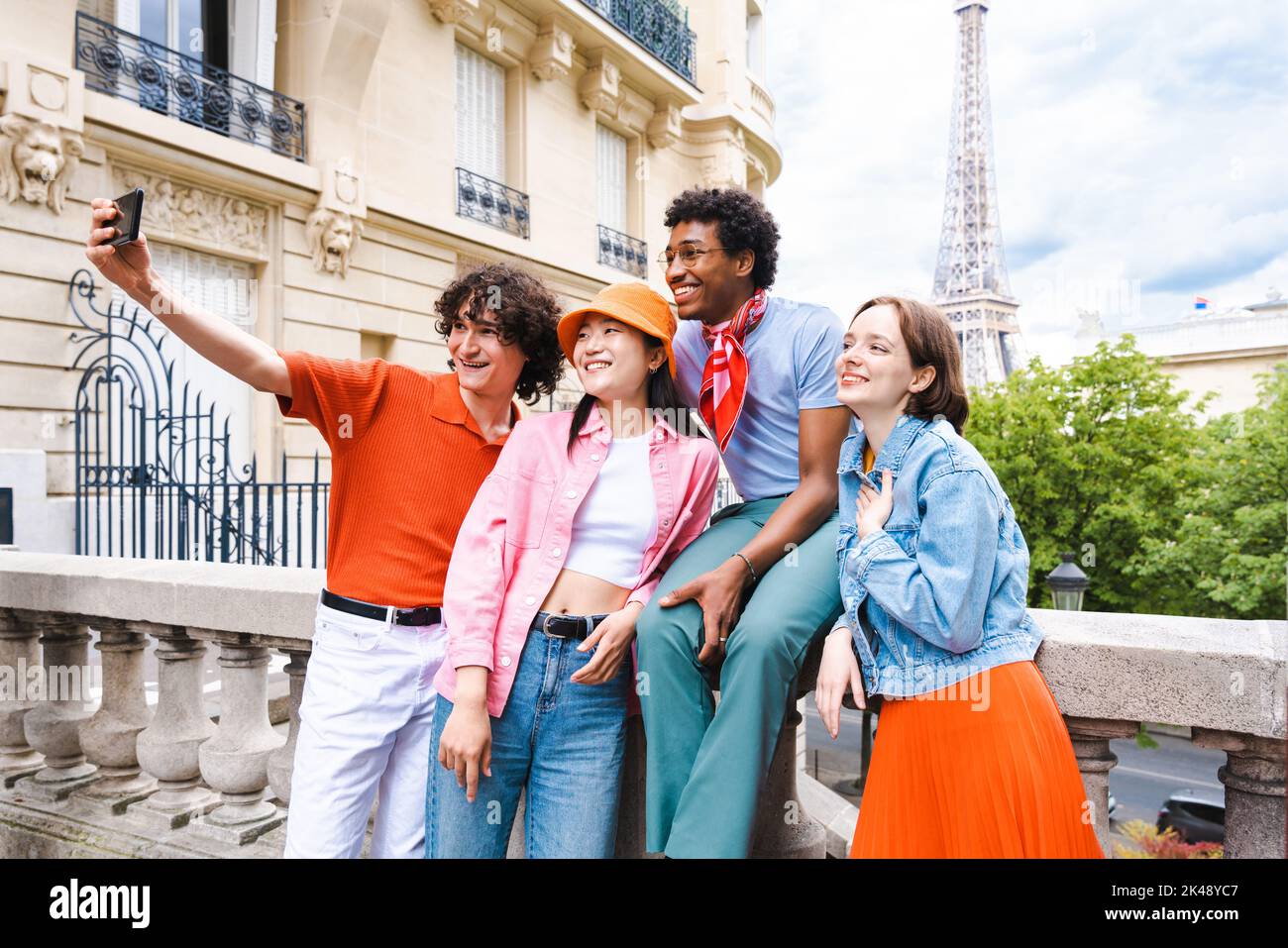 Group of young happy friends visiting Paris and Eiffel Tower, Trocadero ...