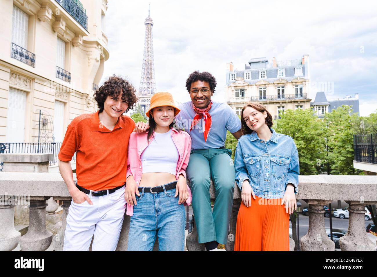 Group of young happy friends visiting Paris and Eiffel Tower, Trocadero ...