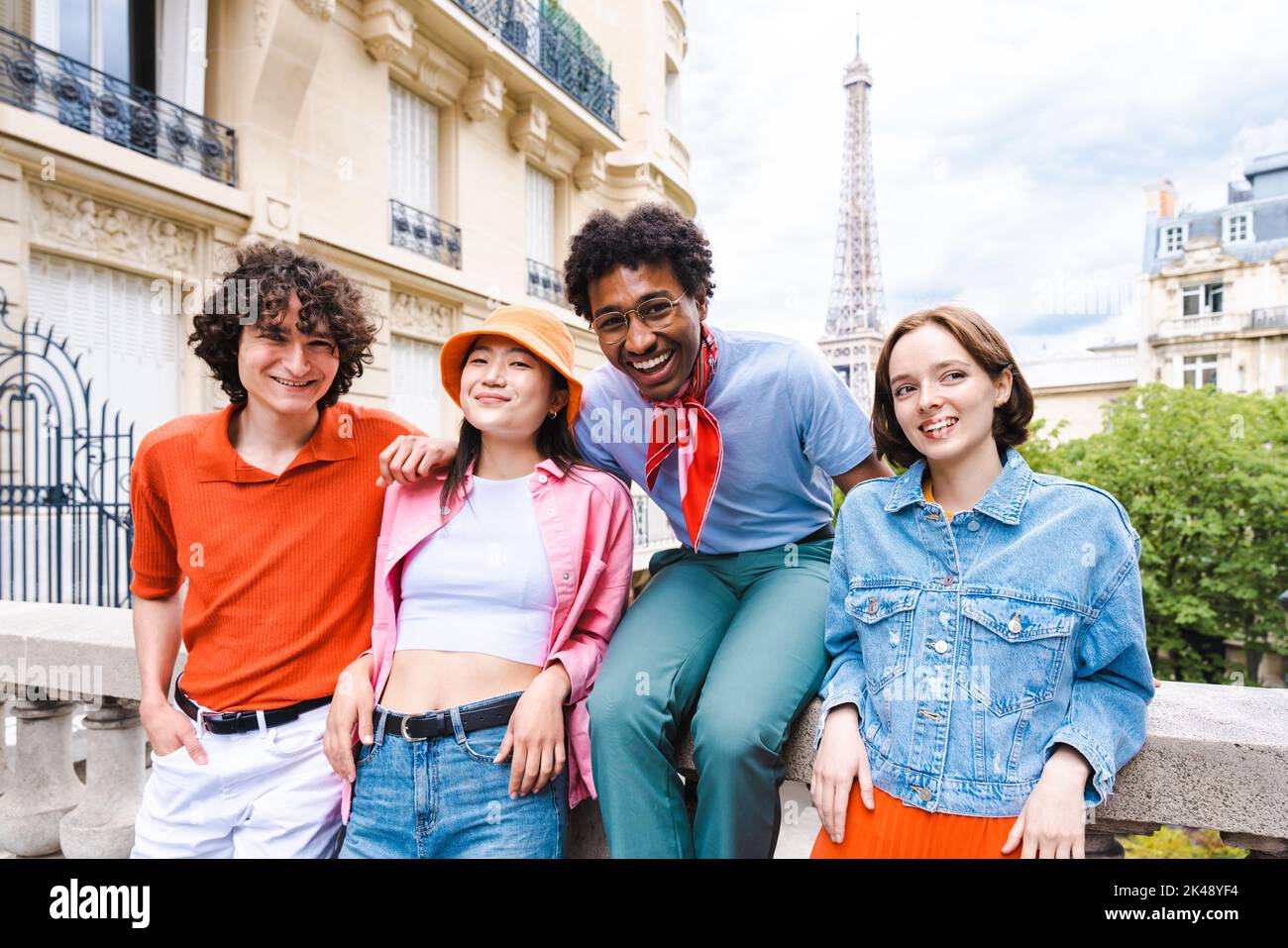 Group of young happy friends visiting Paris and Eiffel Tower, Trocadero ...