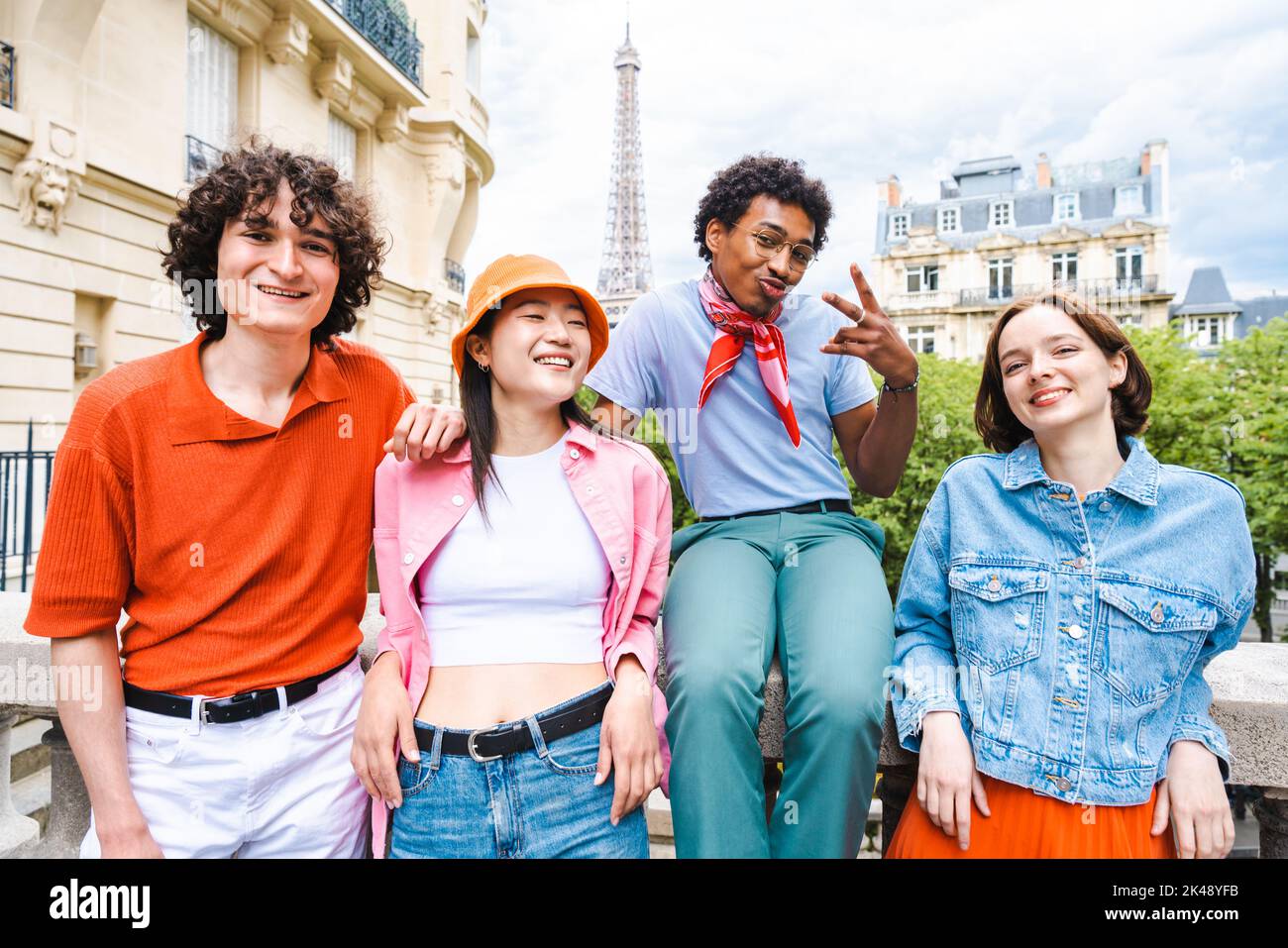 Group of young happy friends visiting Paris and Eiffel Tower, Trocadero ...