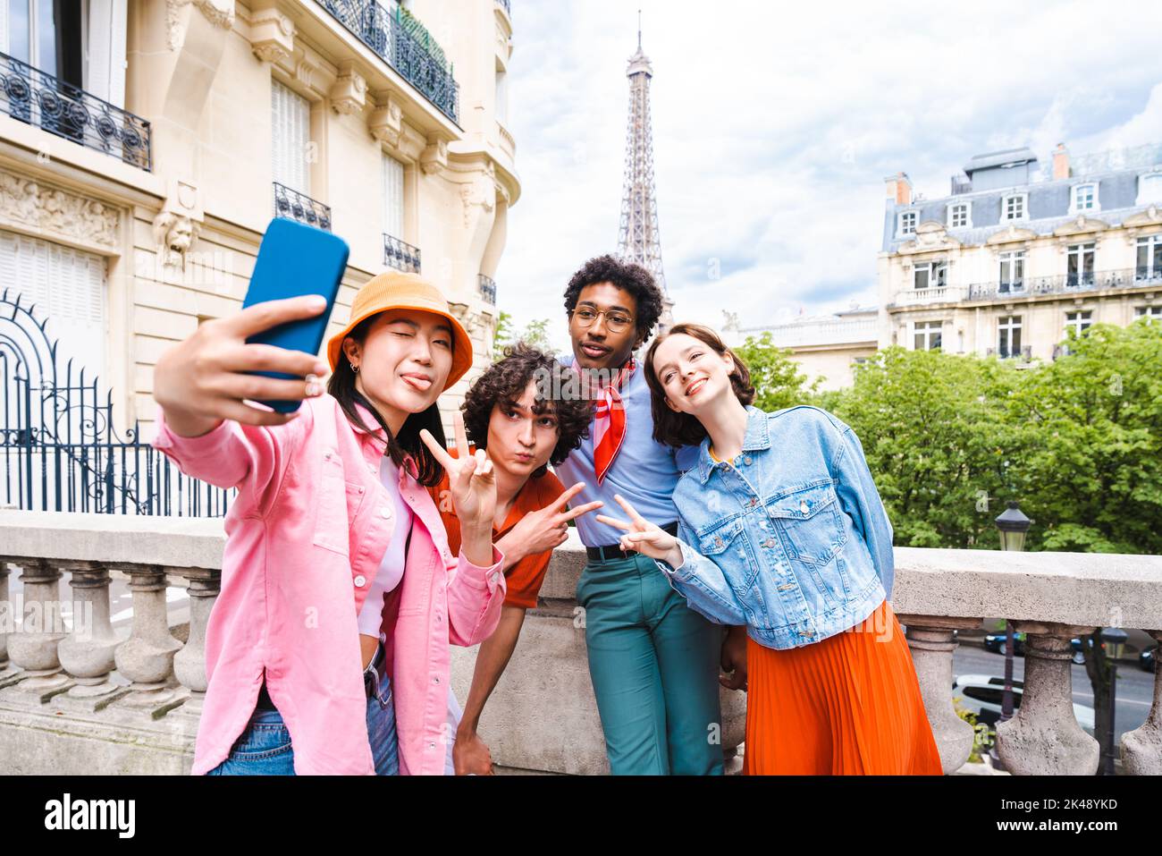 Group of young happy friends visiting Paris and Eiffel Tower, Trocadero ...
