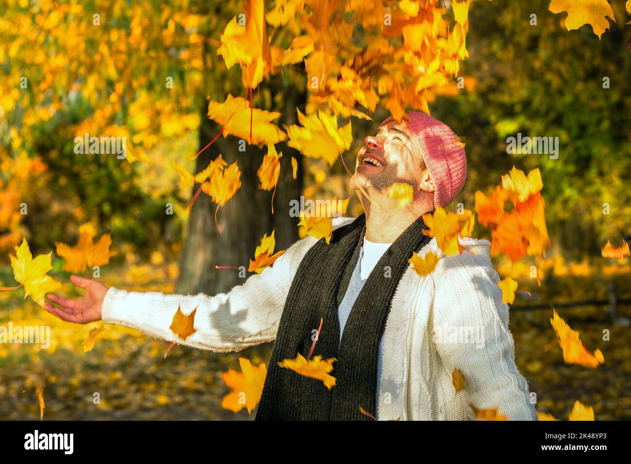 Man throwing leaves into air hi-res stock photography and images - Alamy