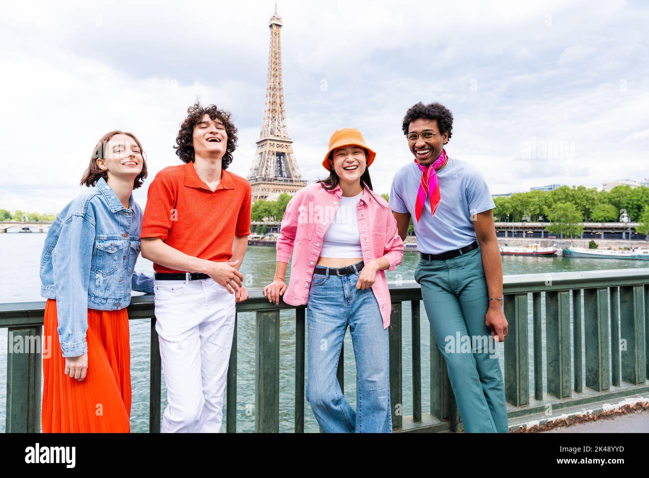 Group of young happy friends visiting Paris and Eiffel Tower, Trocadero ...