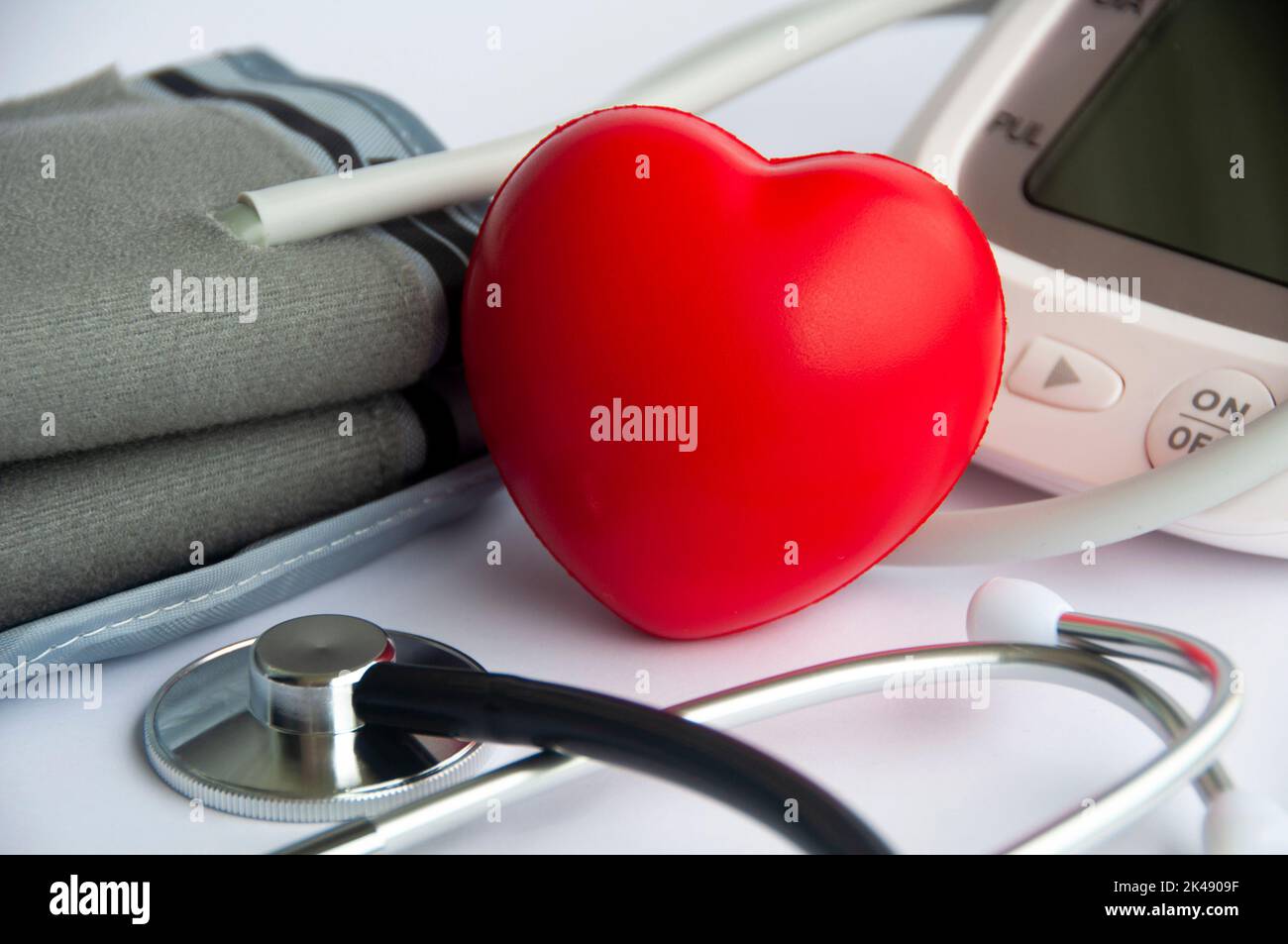 Stethoscope with heart shape and digital blood pressure monitor on ...