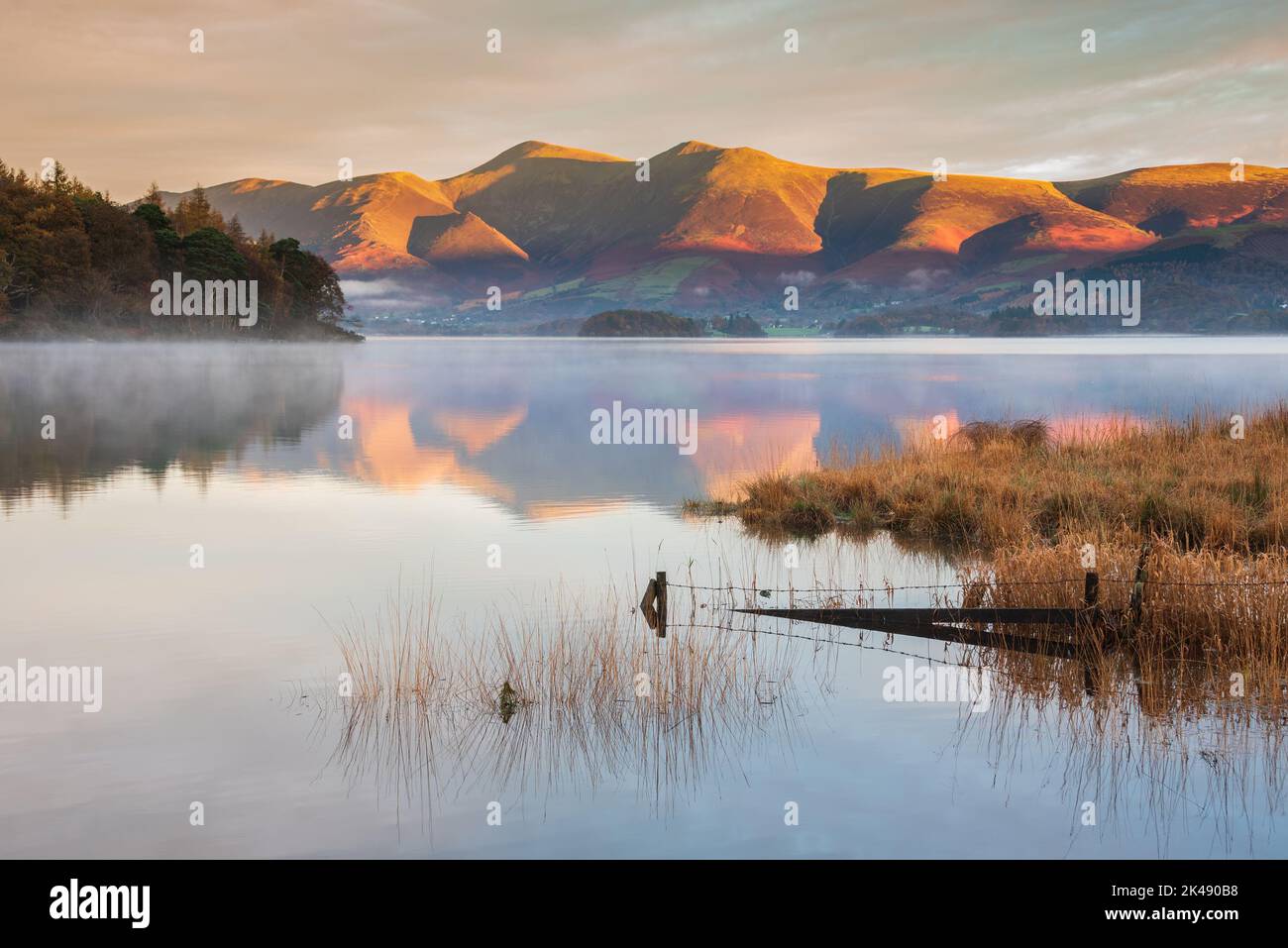 Epic Autumn sunrise landscape image looking from Manesty Park in Lake ...
