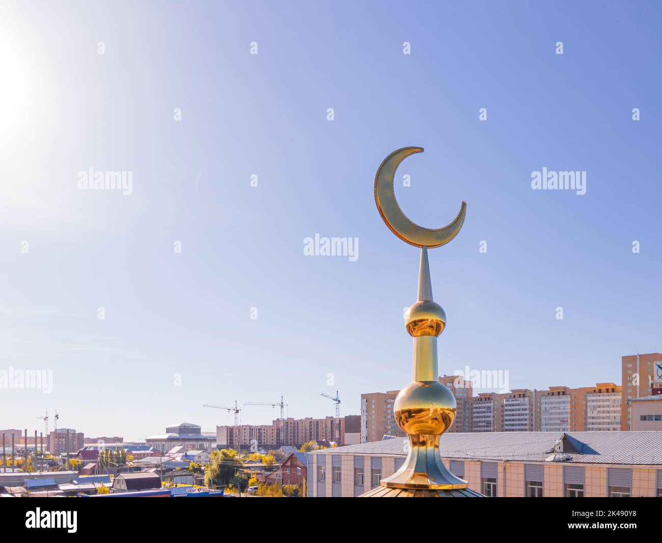 A Muslim golden dome with a crescent moon on the mosque. Minaret ...
