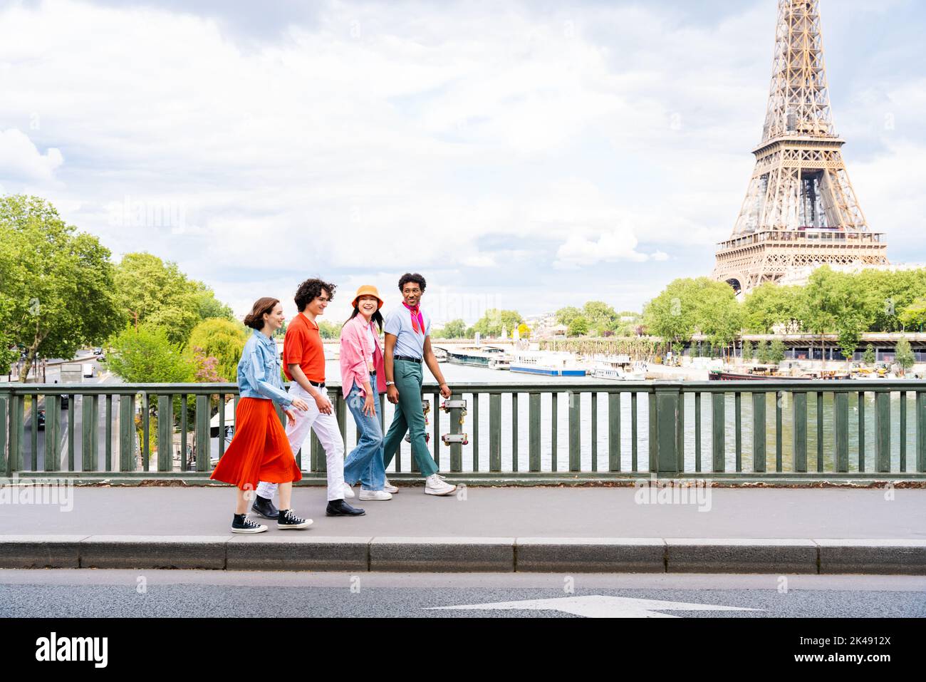 Group of young happy friends visiting Paris and Eiffel Tower, Trocadero ...