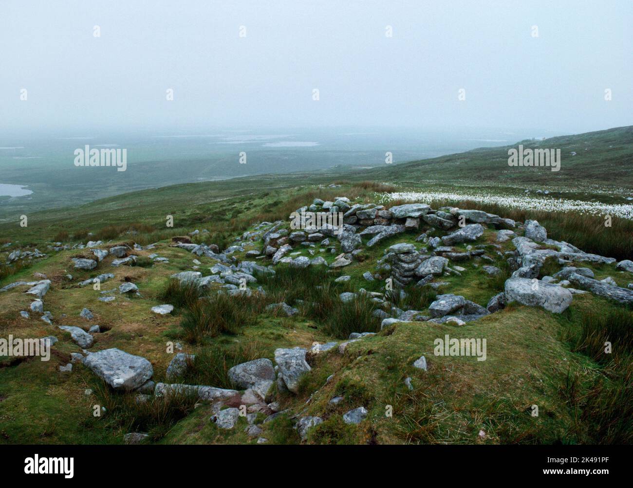 View W of an Iron Age wheelhouse built into a Neolithic chambered tomb ...