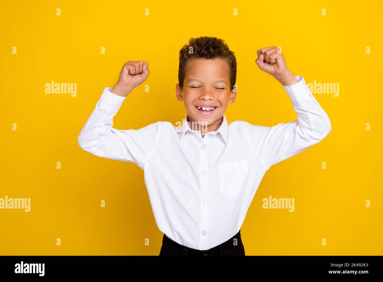 Photo of overjoied cheerful boy raise hand fist rejoice win contest ...
