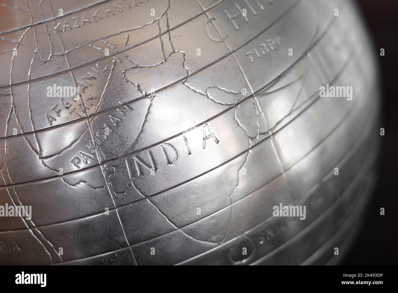 Hand carved engraved metal world globe showing the country of India ...