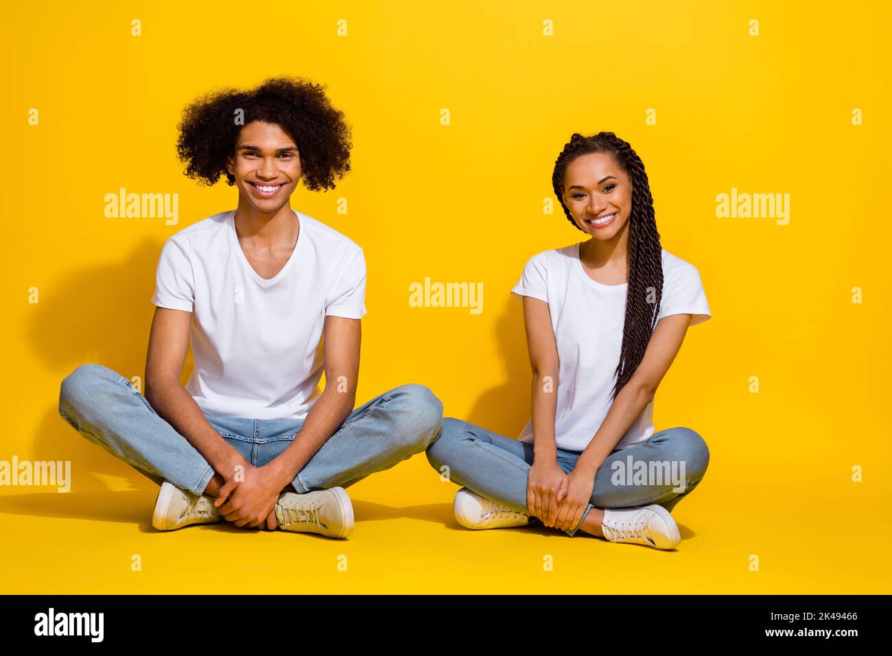 Full size portrait of two positive nice people sit floor have good mood ...