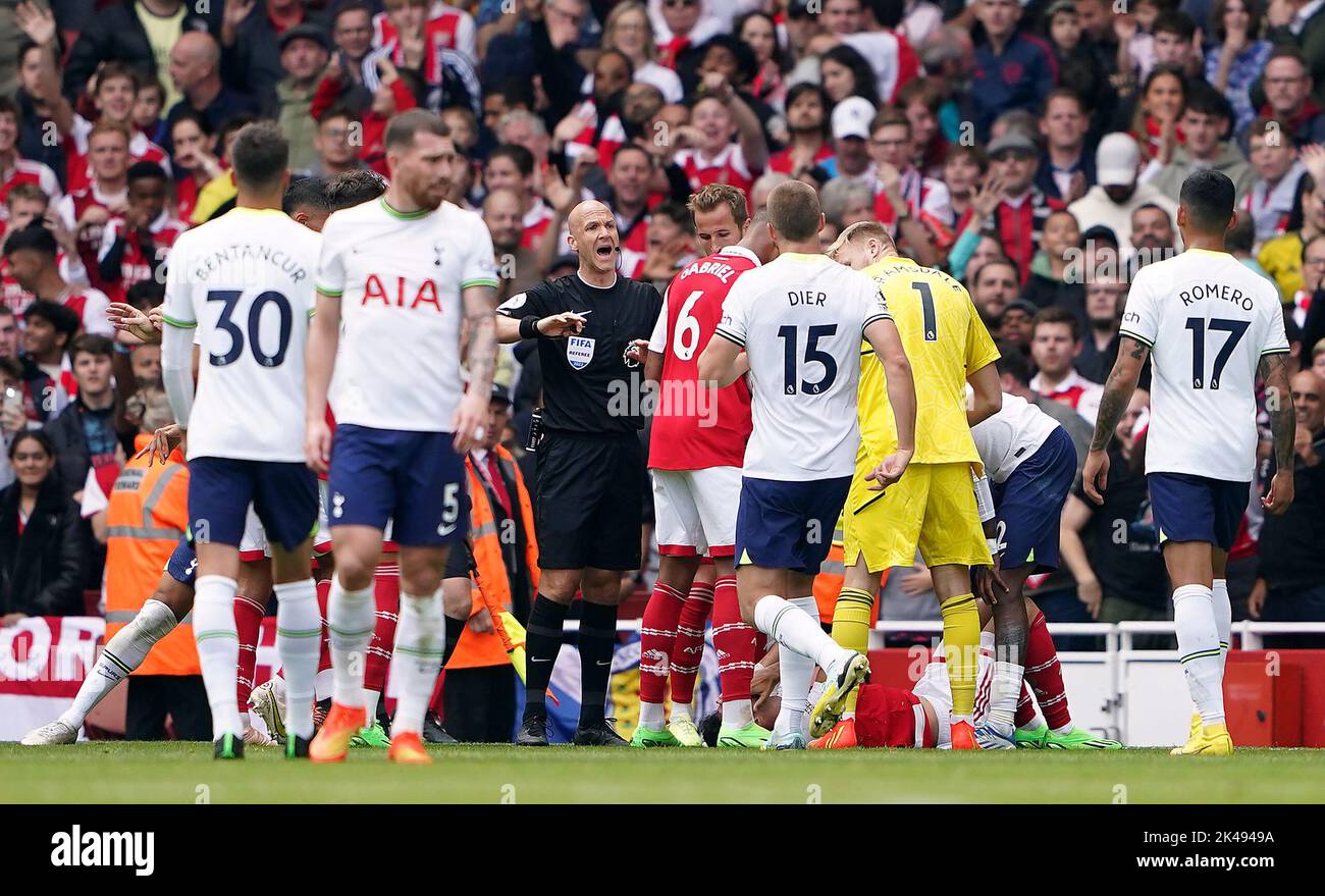 Referee Anthony Taylor speaks to the players after showing a red card ...