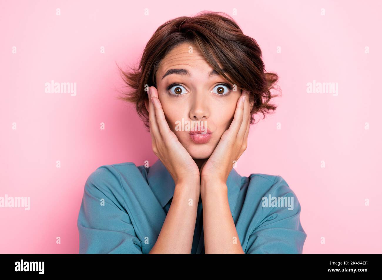 Photo of lovely impressed person hands touch cheeks pouted lips ...