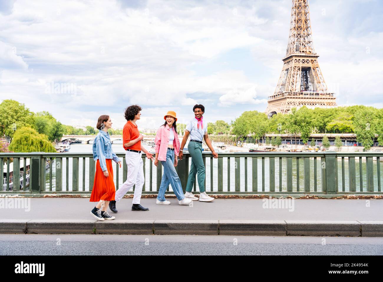 Group of young happy friends visiting Paris and Eiffel Tower, Trocadero ...