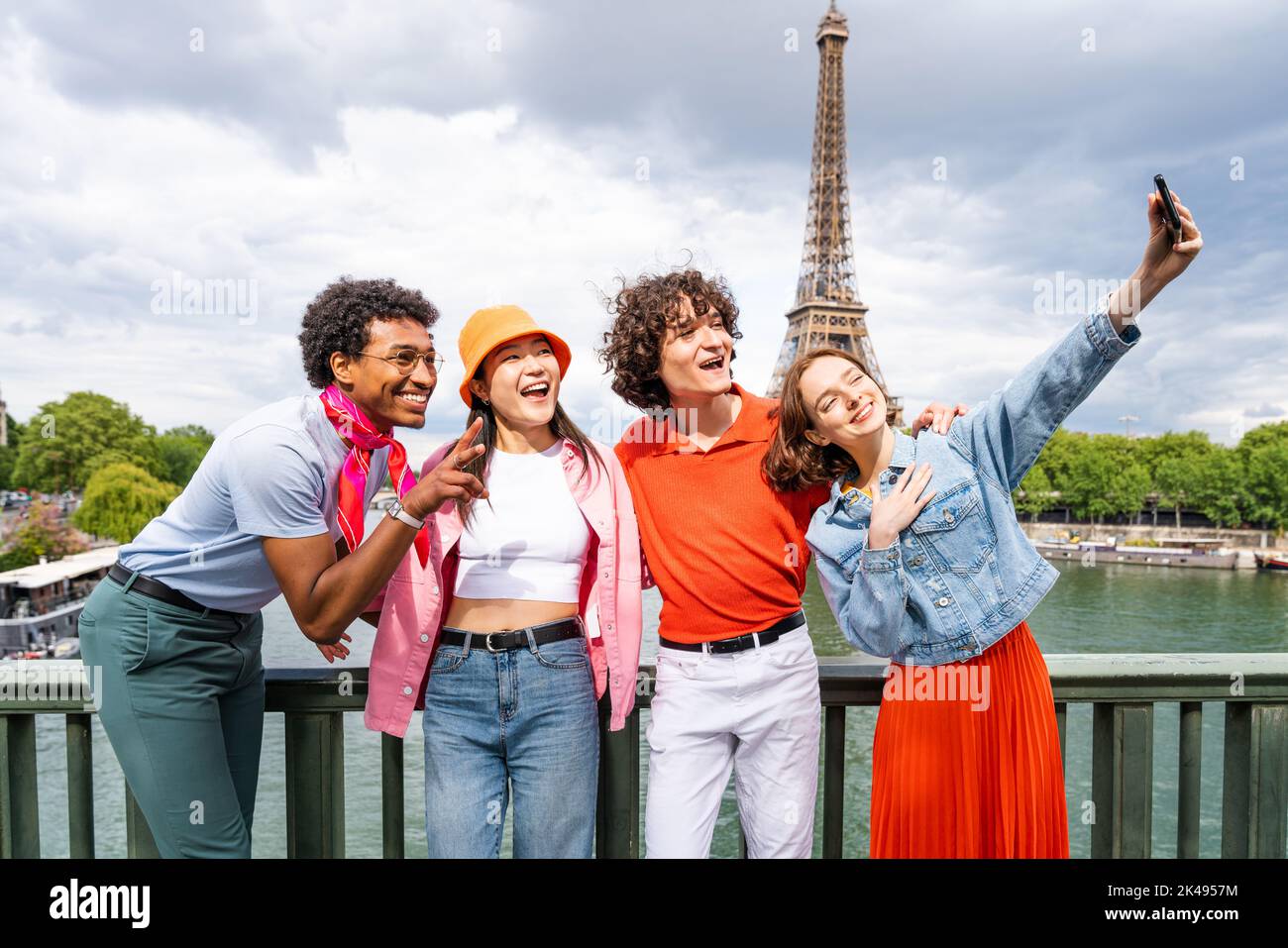 Group of young happy friends visiting Paris and Eiffel Tower, Trocadero ...