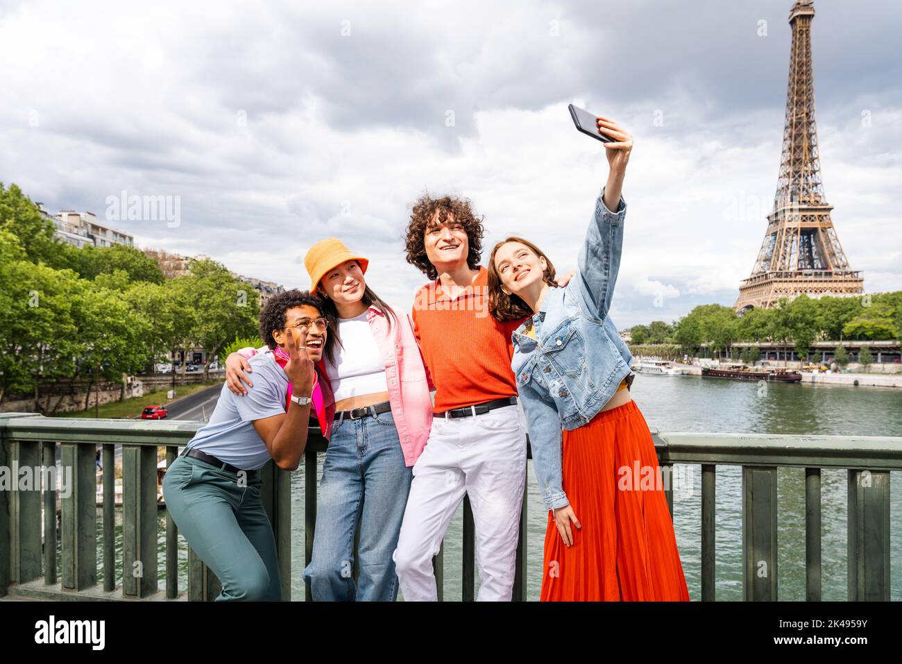 Group of young happy friends visiting Paris and Eiffel Tower, Trocadero ...