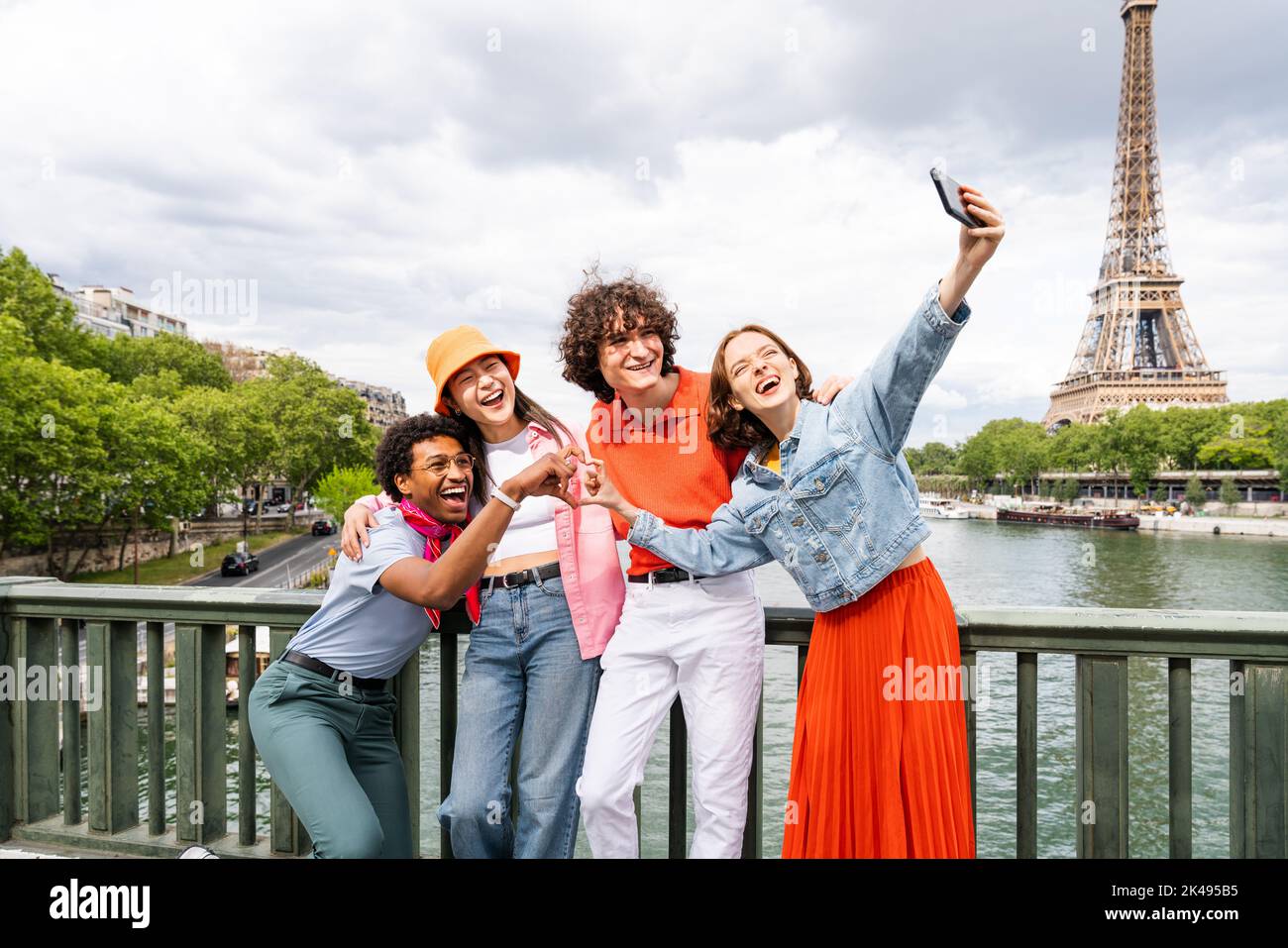 Group of young happy friends visiting Paris and Eiffel Tower, Trocadero ...