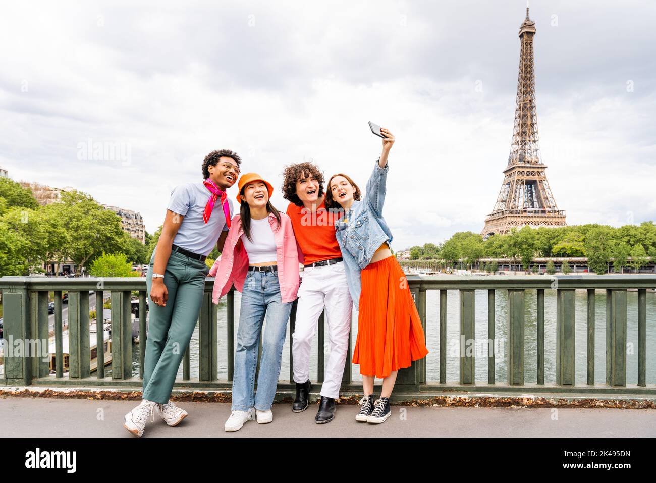 Group of young happy friends visiting Paris and Eiffel Tower, Trocadero ...