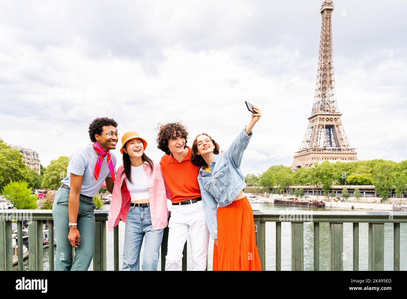 Group of young happy friends visiting Paris and Eiffel Tower, Trocadero ...